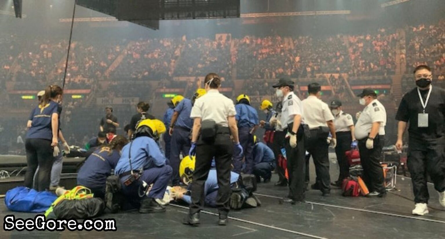 Big TV screen falls onto a boy band - SeeGore